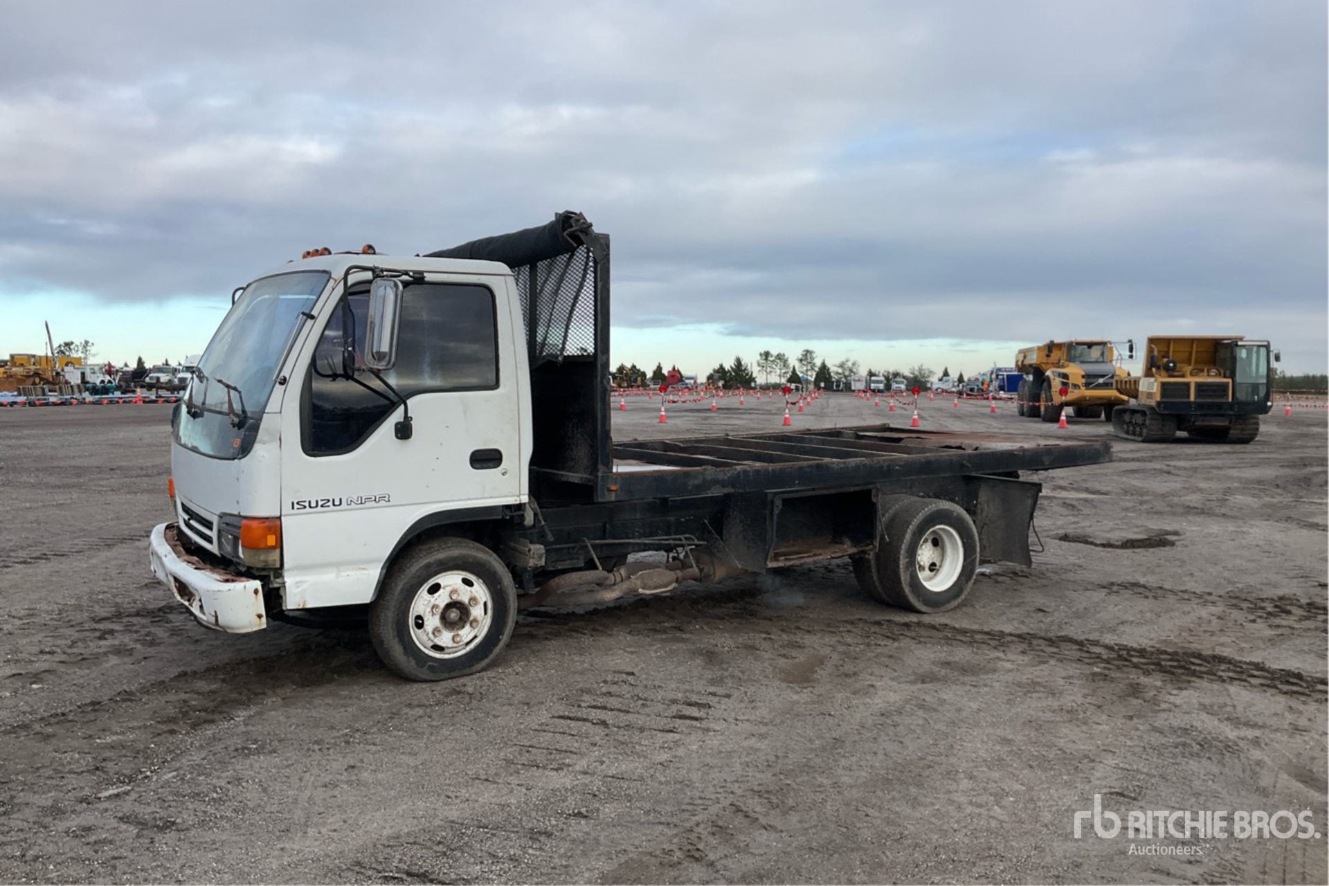 1997 Isuzu NPR 4x2 COE Flatbed Dump Truck | Ritchie Bros. Auctioneers